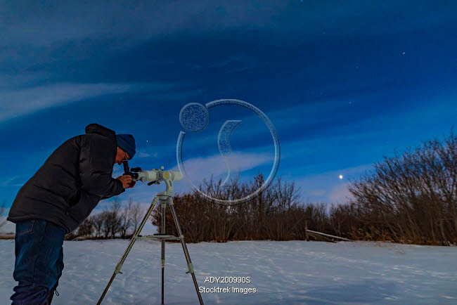 Astronomer observing Venus in clouds and in the moonlight. | Stocktrek ...