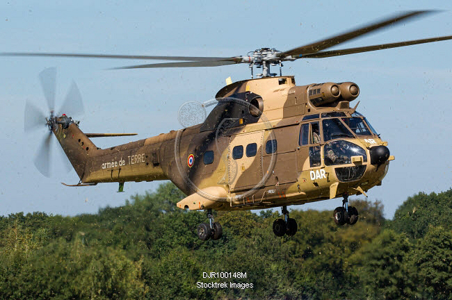 A French Army SA330 Puma transport helicopter kicking leaves while ...