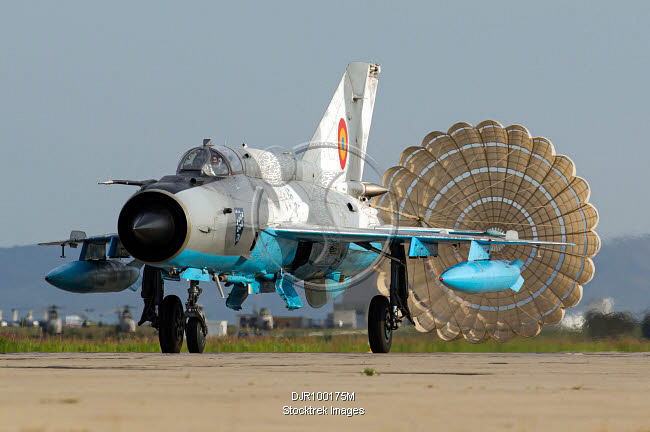 A Romanian Air Force MiG-21 LanceR landing with its brake chute ...
