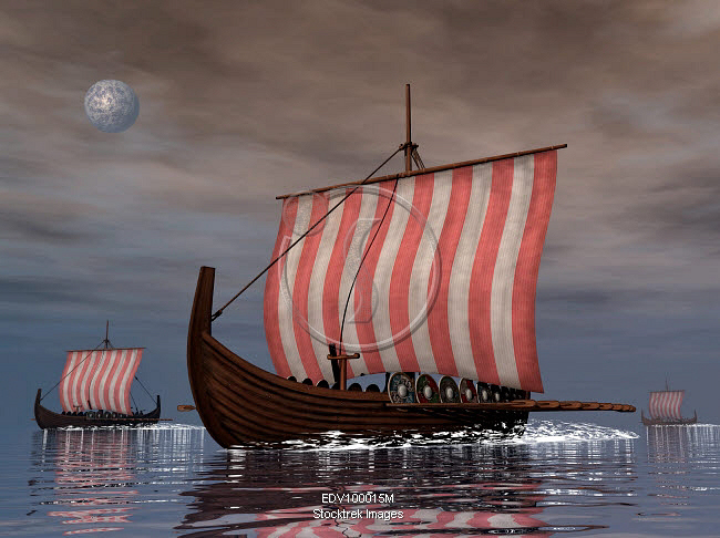 Drekar Viking ships navigating the ocean at night. | Stocktrek Images