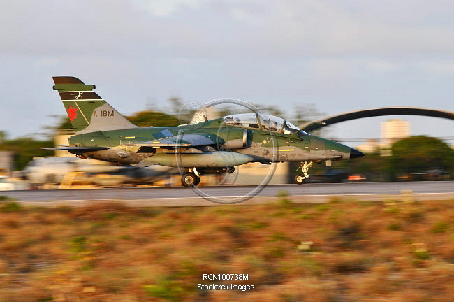 An A-1BM of the Brazilian Air Force landing on runway. | Stocktrek Images