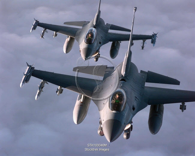 Two F-16 Fighting Falcons fly in formation. | Stocktrek Images