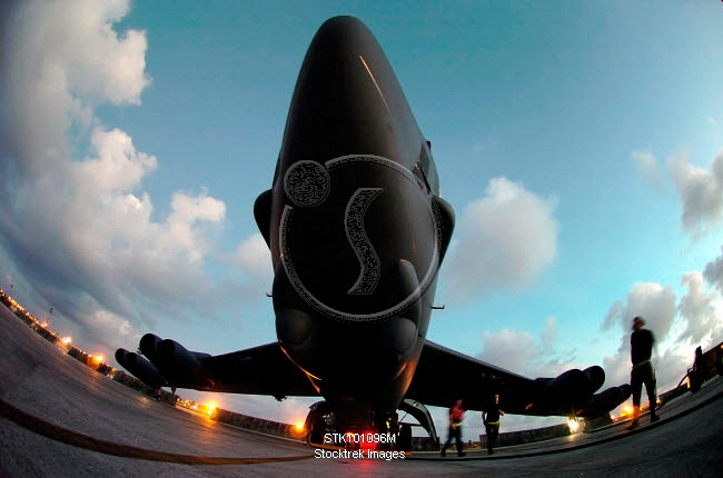 A B-52 Stratofortress bomber sits on the flightline before night ...