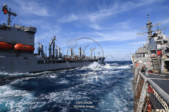 USS Porter sails alongside the fleet replenishment oiler USNS Joshua ...
