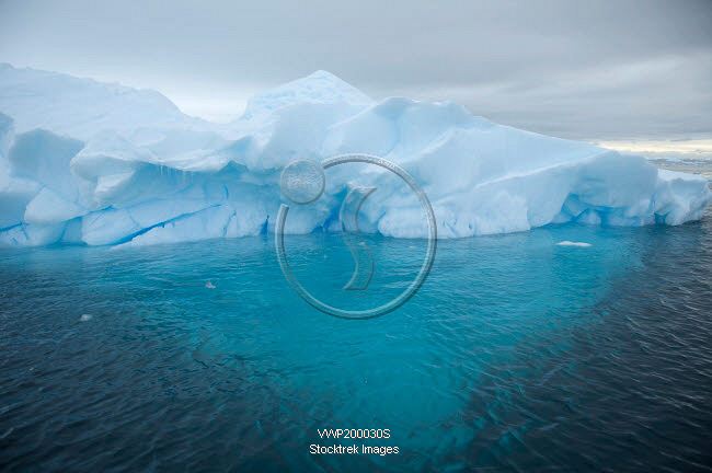 Iceberg grounded in shallow bay, Antarctica. | Stocktrek Images