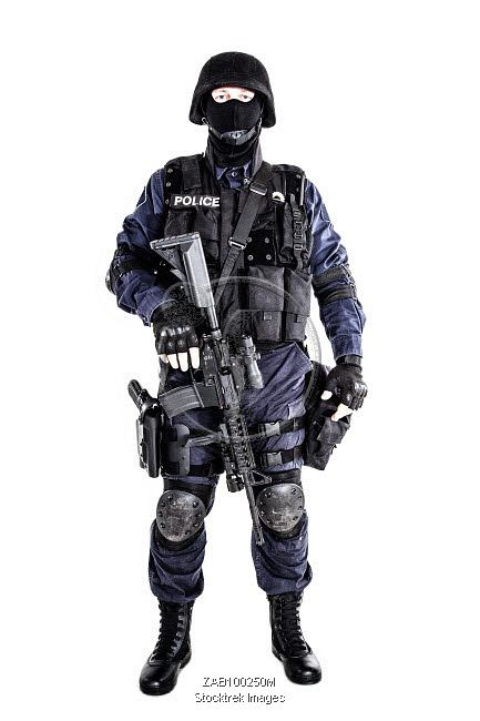 Special weapons and tactics (SWAT) team officer with his gun ...