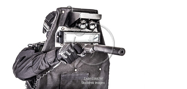SWAT team fighter hiding behind ballistic shield and aiming pistol ...